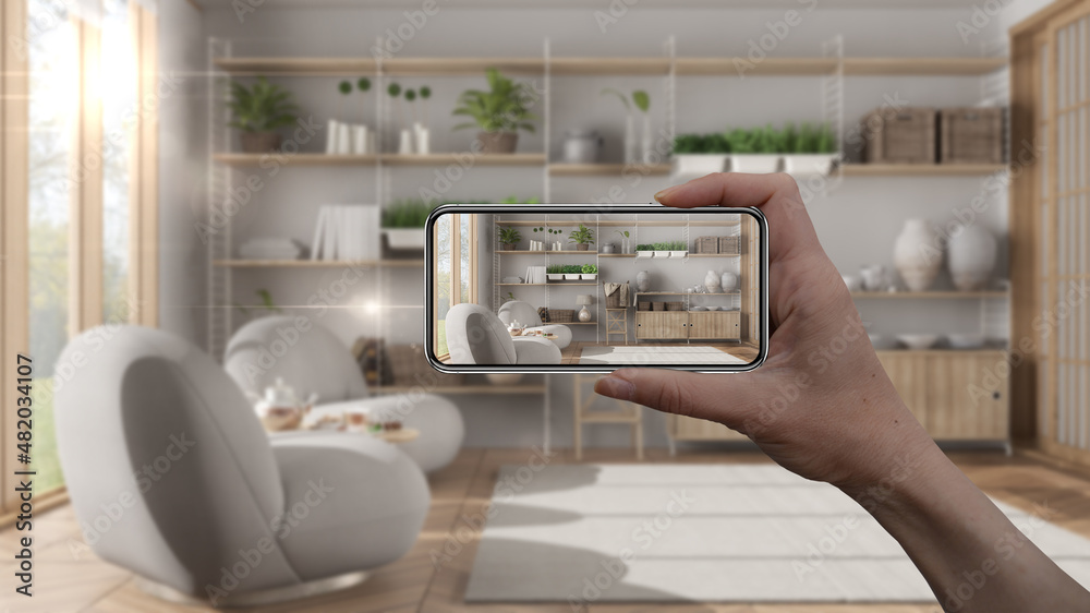 Hand holding smart phone, AR application, simulate furniture and ...