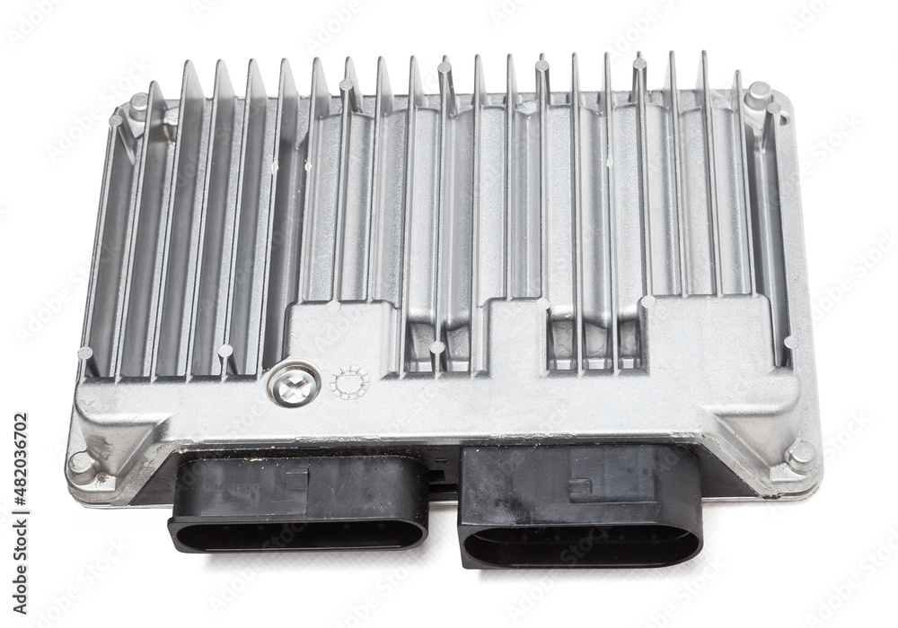 Metallic car engine control unit with plastic elements on a white ...