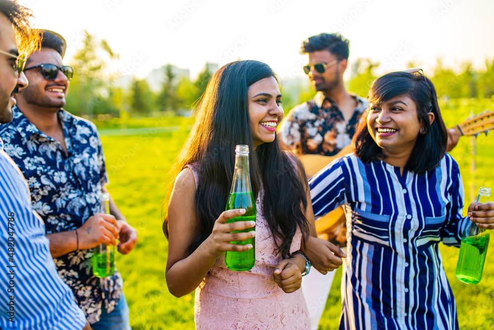 pakistanian happy best friends partying with lemonade and beer in ...