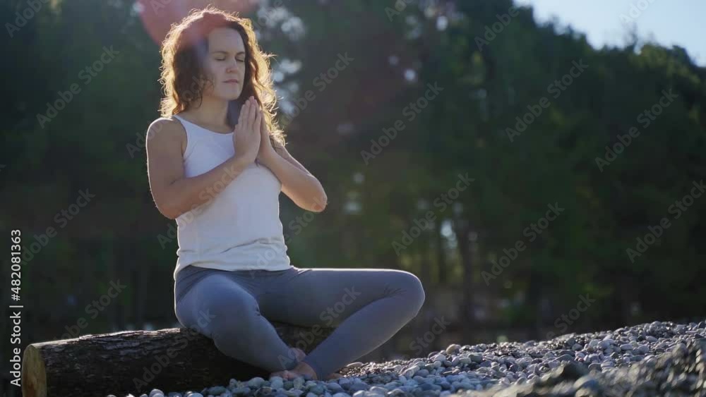 Woman praying, prayer. Beautiful female breathing gently and sits in ...