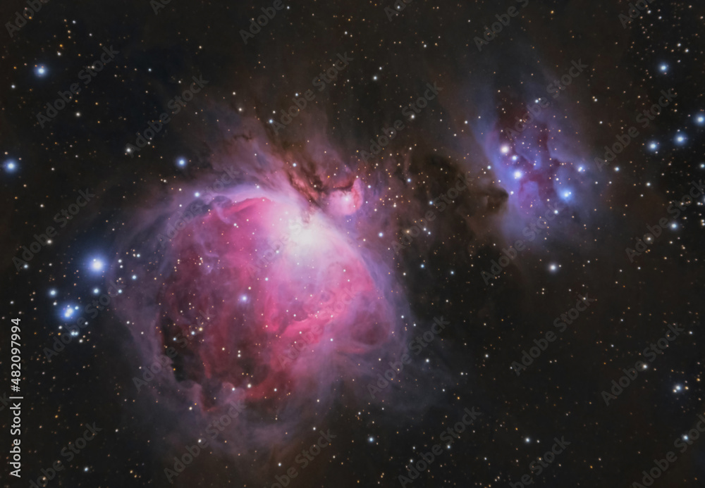 The Orion Nebula (Messier 42) and the Running Man Nebula (NGC 1977) photographed with an ...
