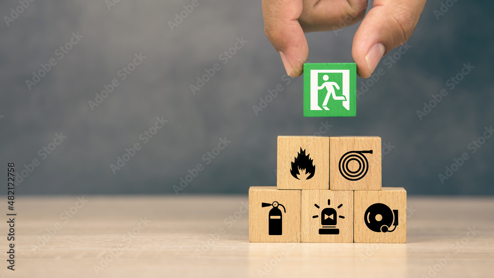 Hand choose wooden block stack with door exit sing or fire escape and ...