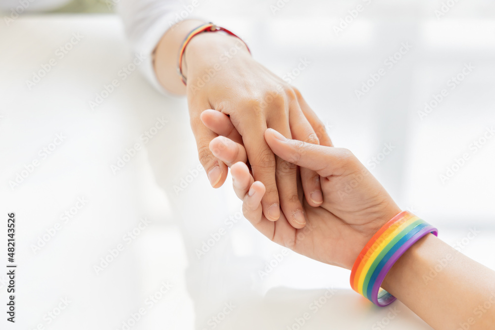 LGBT peoples' helping hand holding each other, concept of LGBT pride ...