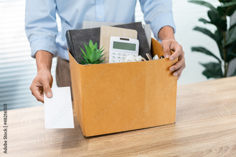 Resignation Concept The male officer standing, putting his box of his ...