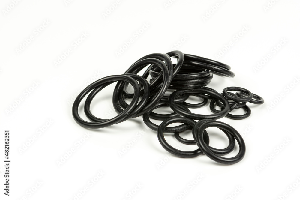 Hydraulic and pneumatic o-rings in black in different sizes on a white ...