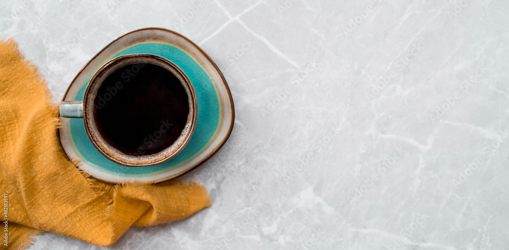 Cafes and restaurants. A stylish mug of invigorating black coffee and a ...