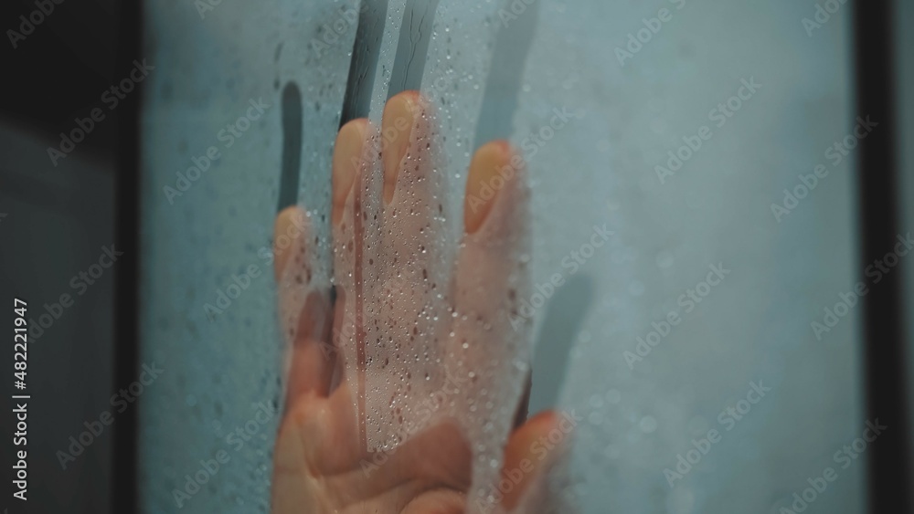 Hand of Caucasian Female Touching Wet Shower Cabin Glass Swiping Water ...