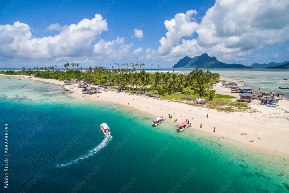 Aerial view of Maiga island panorama, beautiful blue lagoon and coral ...