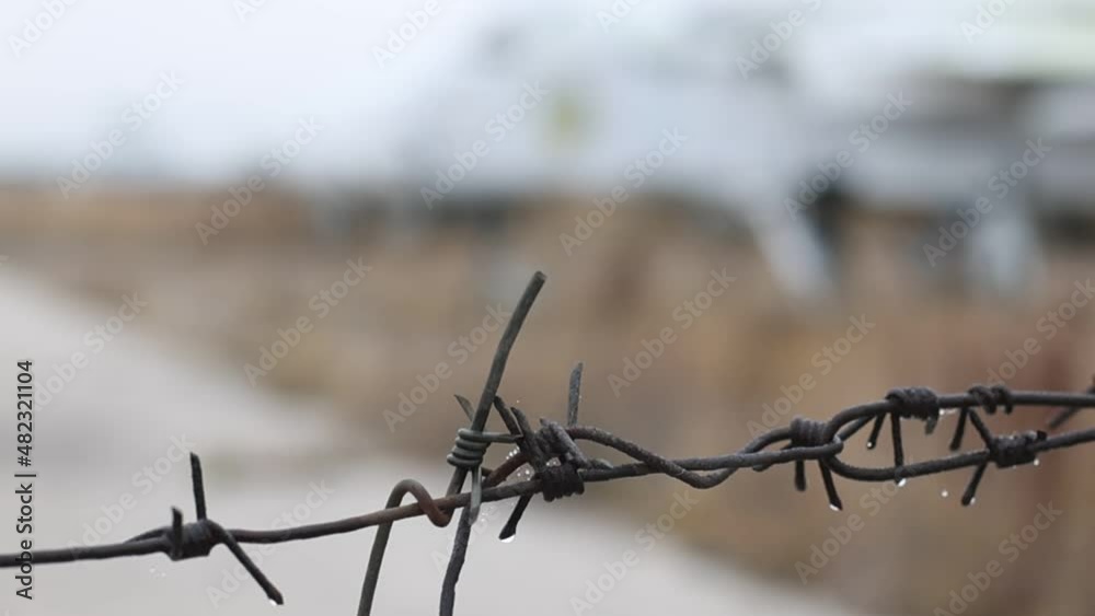 Footage of a closed area behind the barbed wire of a military airfield ...