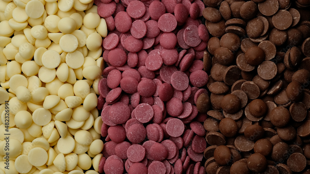 Chocolate. White, ruby, milk chocolate chips top view. Different types ...