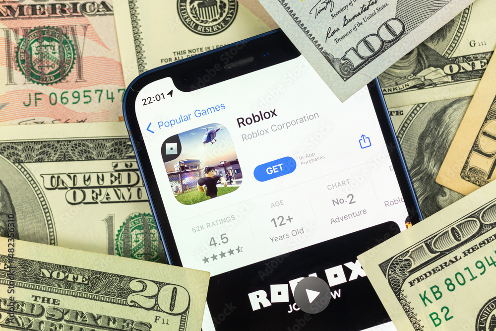 Roblox mobile game app and money background Stock Photo | Adobe Stock