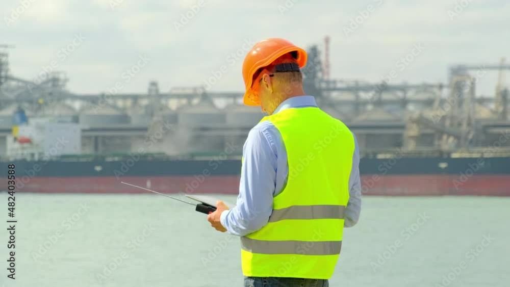 Vidéo Stock Port sea ship marine technology. Middle aged worker with ...