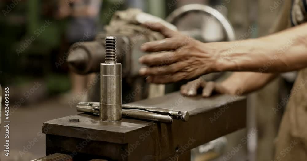 Close-up at hands of worker using industrial factory spare parts ...