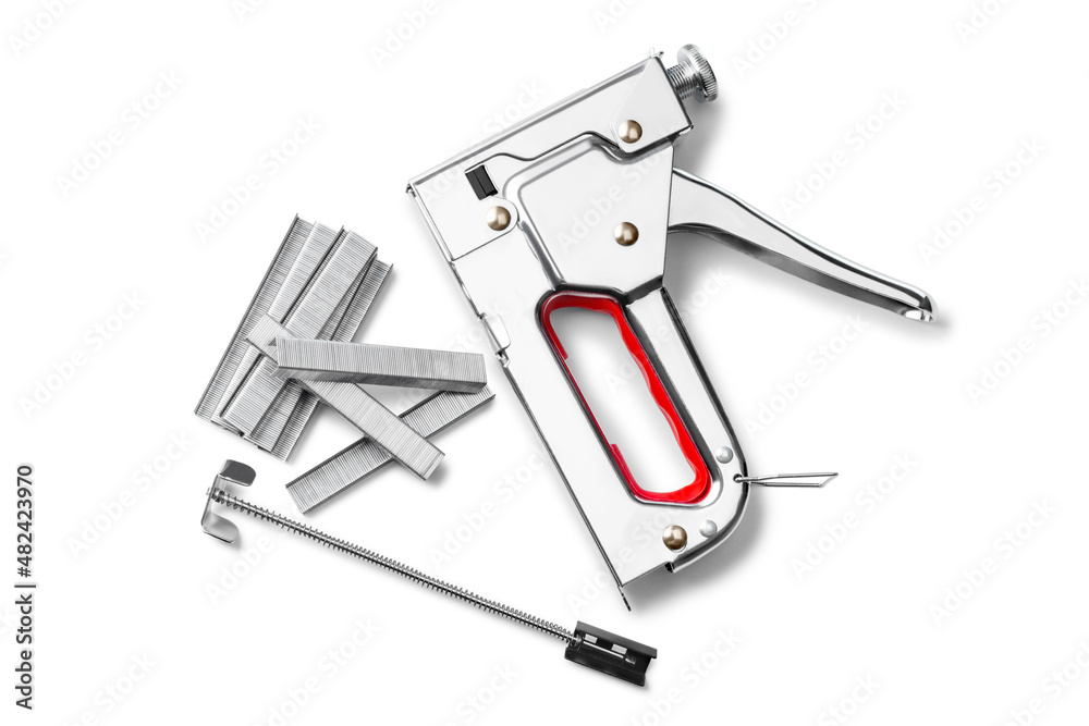 Stapler gun and stack of metal staples isolated on white background ...