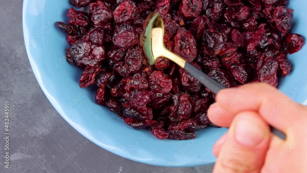 Dried cranberries in blue bowl top view. Healthy tasty dry red berries ...