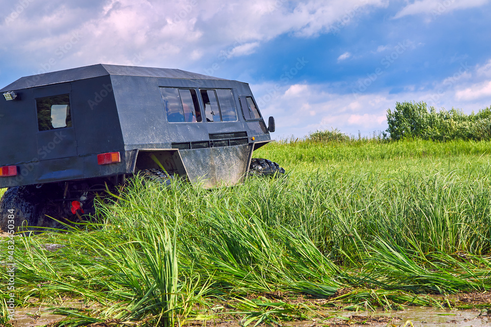 Large powerful off-road transporter on the background of a blue sky ...