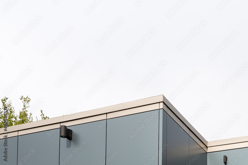 The exterior wall of a contemporary commercial style building with ...