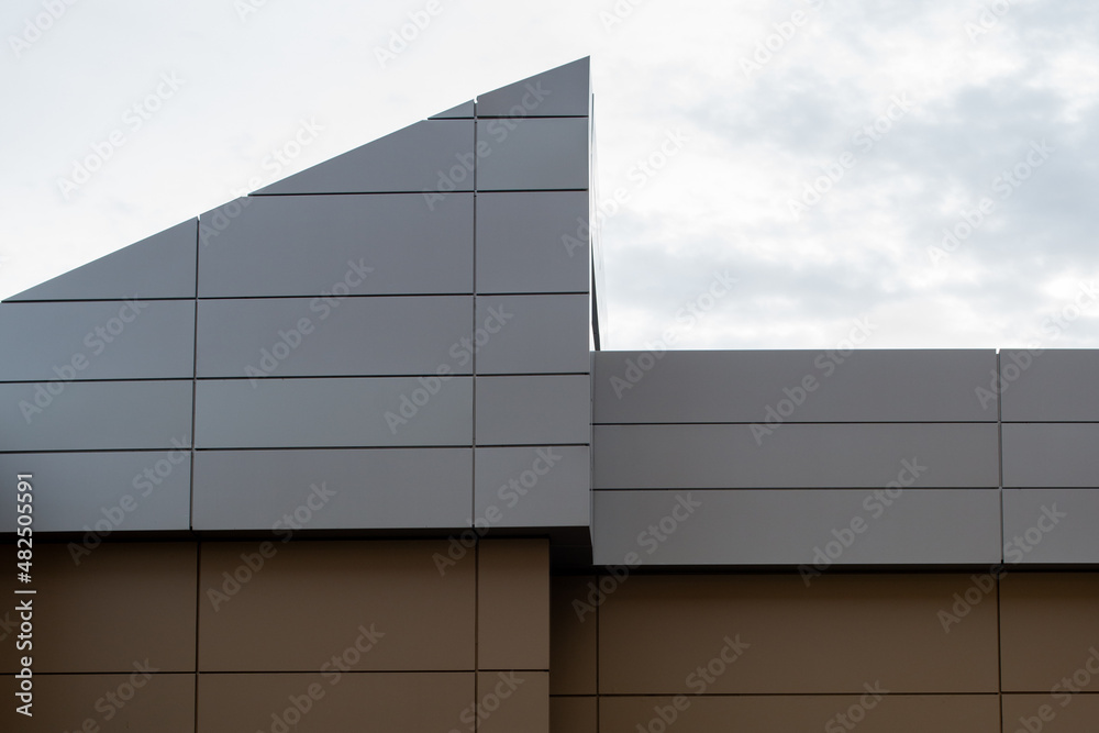 The exterior wall of a contemporary commercial style building with ...