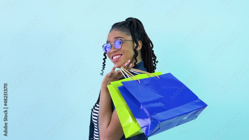 Cute cheerful young african american girl in blue clothes holding ...