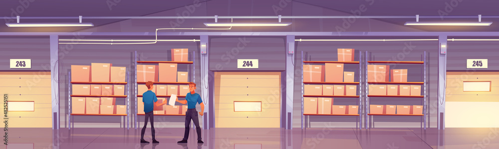 Warehouse with workers, cardboard boxes on shelves and closed gates ...