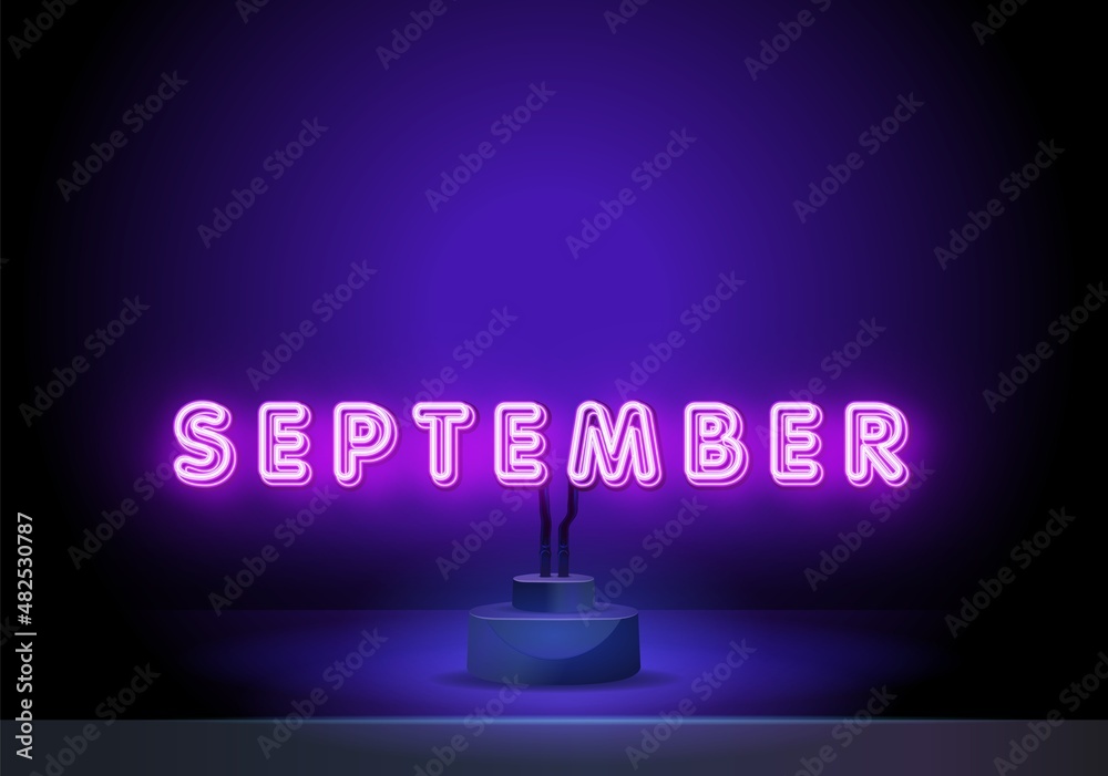 September Neon glowing lettering on a dark wall background. Hello ...