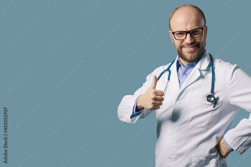 Confident doctor giving a thumbs up Stock Photo | Adobe Stock