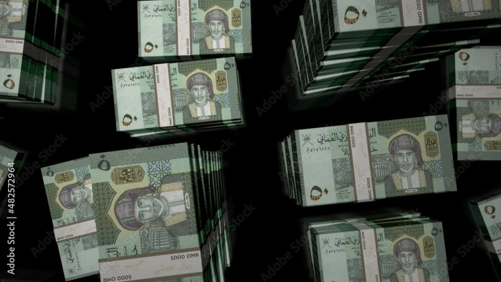 Oman Rial money pack loop. Flight over OMR banknotes stacks top view ...