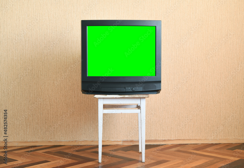 Old green screen TV on an old chair, old house design in 1980s and ...