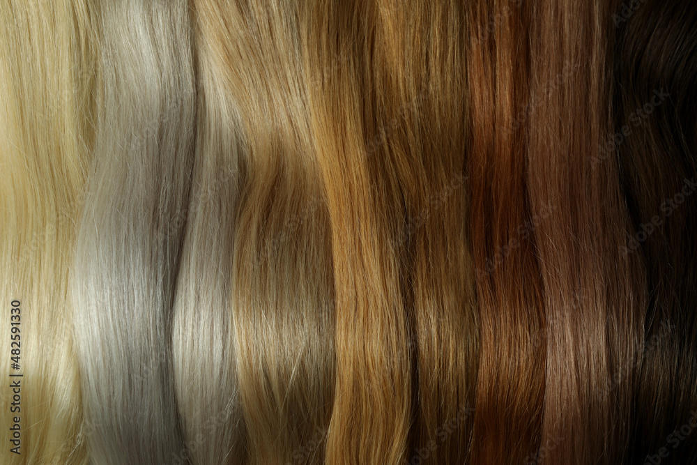 Different color female hair on whole background, close up Stock Photo ...