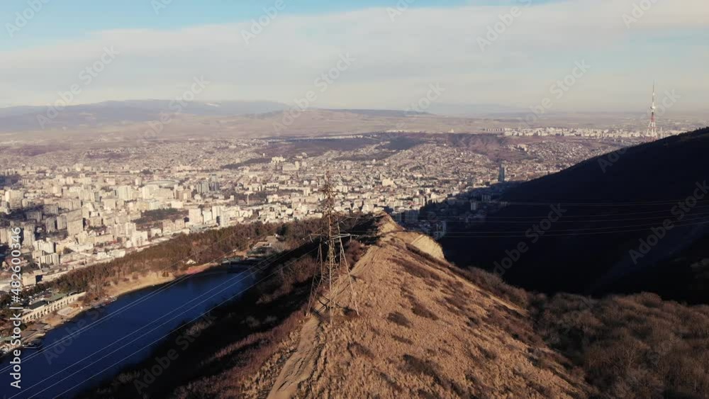 Tower of power lines in the forest. Electric tower line in Landscape ...