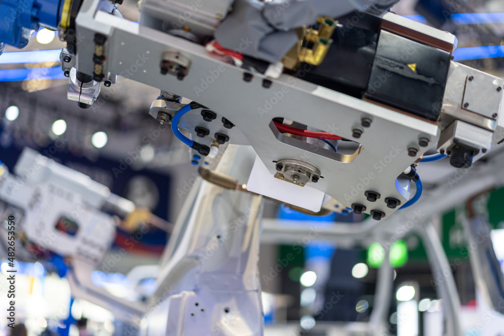 Robot arm working in car factory Stock Photo | Adobe Stock