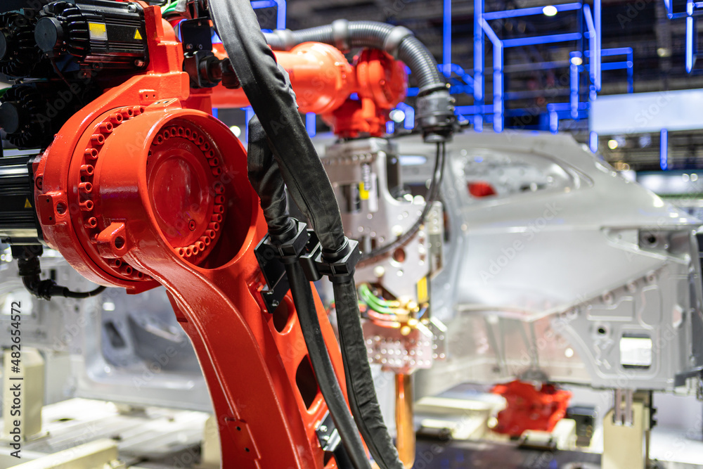 Robot arm working in car factory Stock Photo | Adobe Stock