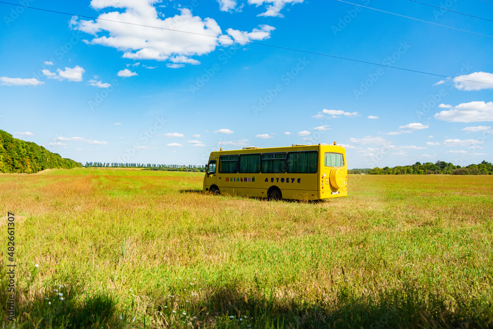 Ukraine, Kanev - September 11, 2021:Yellow school bus in the field ...
