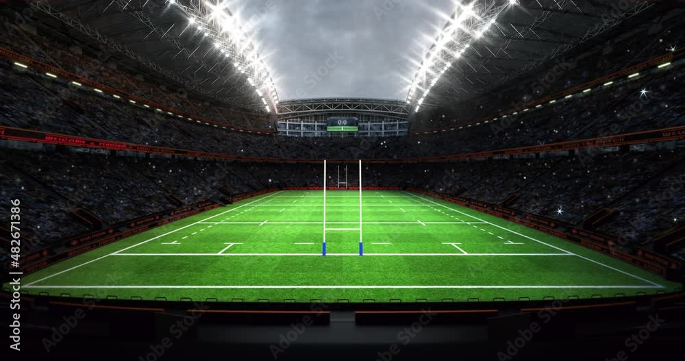 Rugby stadium with goal posts from grandstand view. Grassy playground ...
