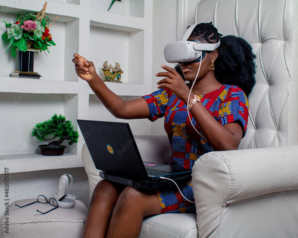 Female making hand gestures and wearing vr headset connected to ...