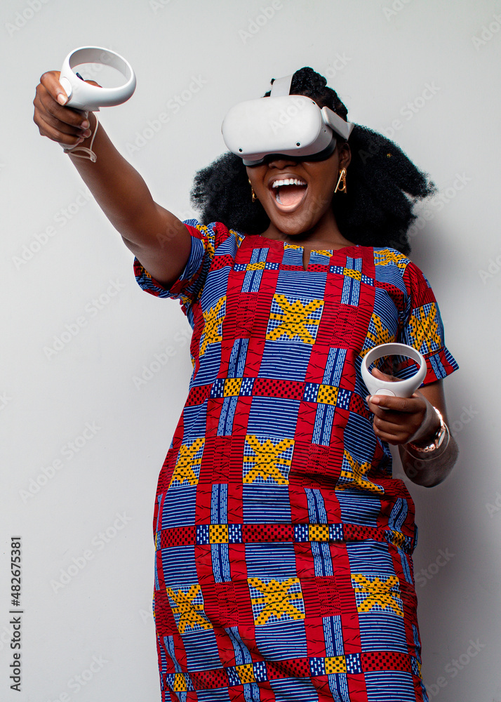 Cheerful african female with VR headset and controllers Stock Photo ...