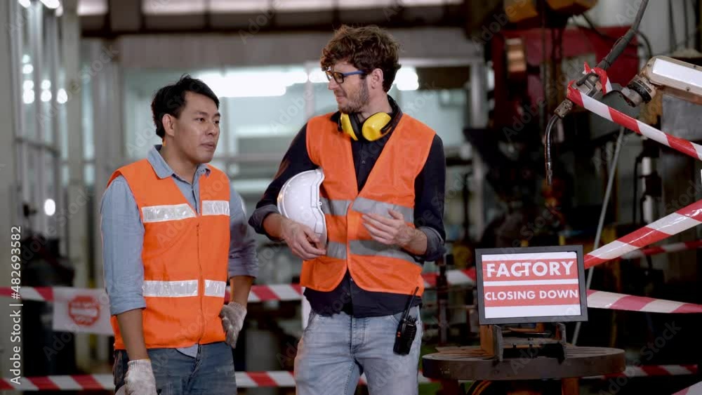 factory worker standing restricted area in factory workplace. young ...