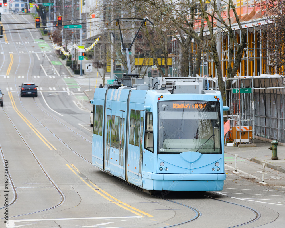 Seattle - January 22, 2022; Seattle streetcar in baby blue color on the ...