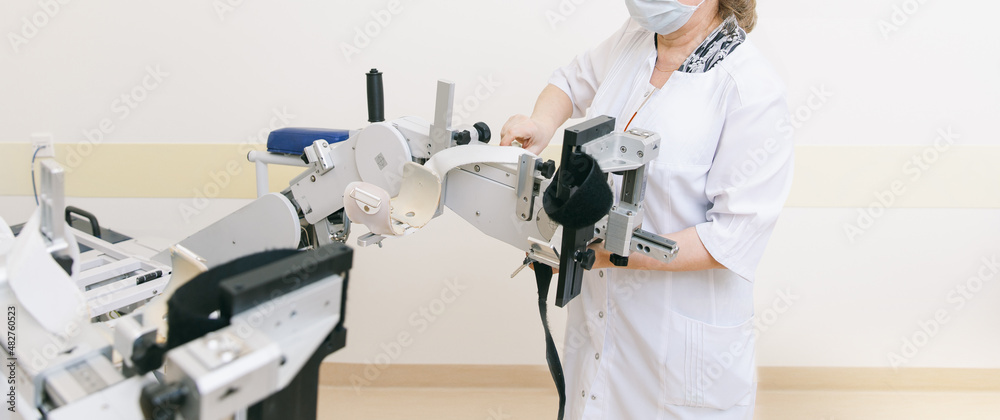 Patient on Continuous Passive Range of Motion machines. Device to ...