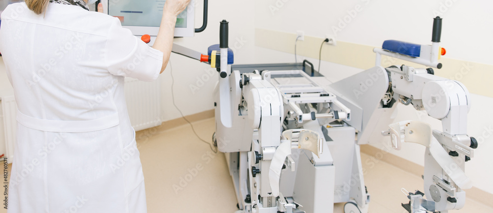 Patient on Continuous Passive Range of Motion machines. Device to ...