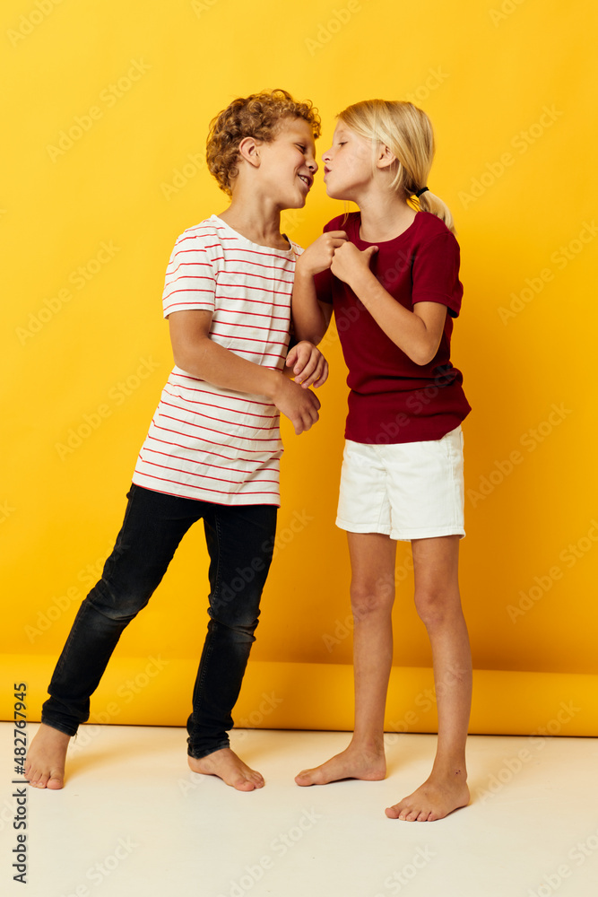 Portrait of cute children standing side by side posing childhood ...