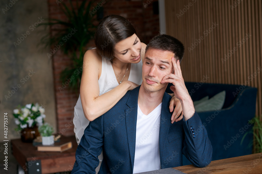 Two handsome people, business partners and colleagues, standing side by ...