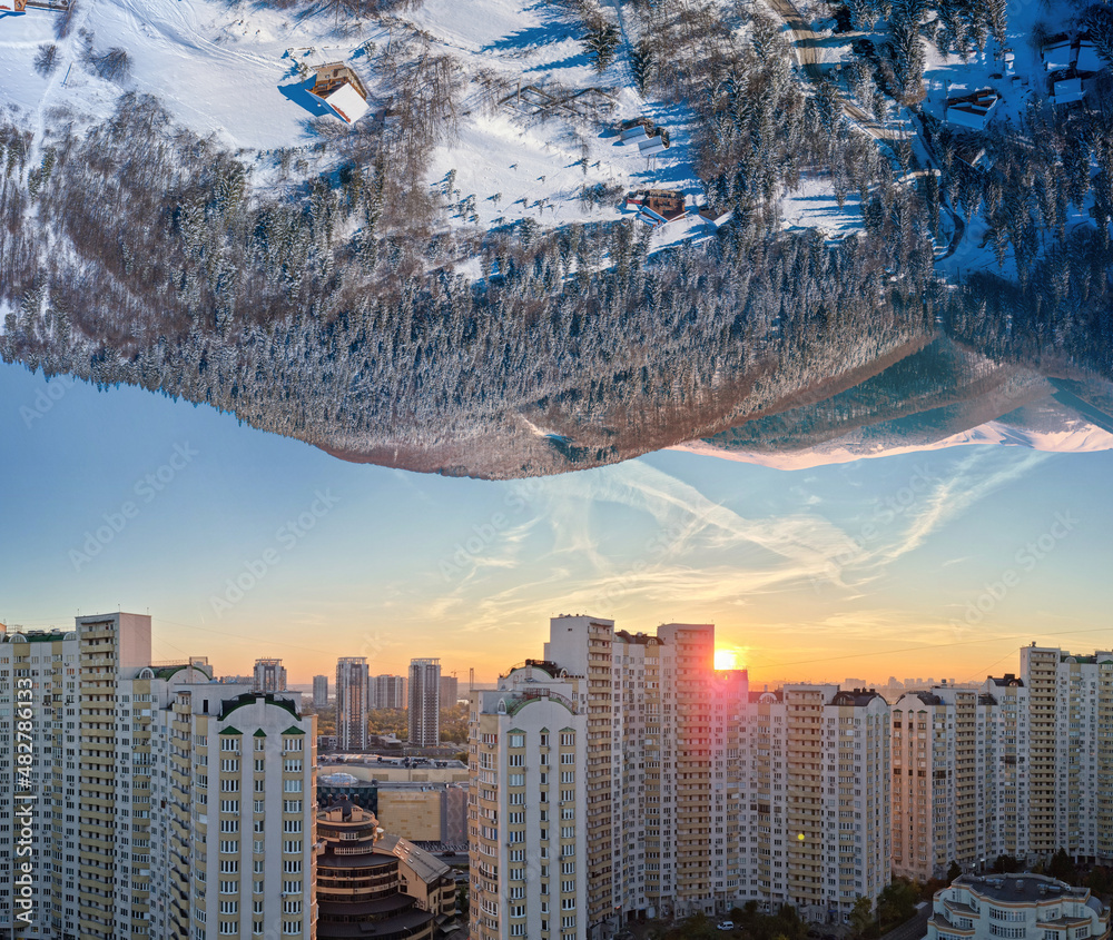 Nature versus city. Beautiful mountain landscape from one side and city ...