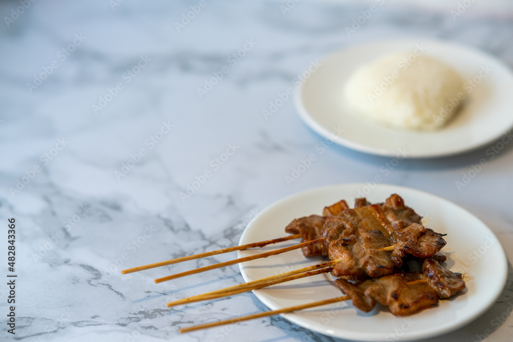 grilled pork with sticky rice on a white marble plate leave space Stock ...