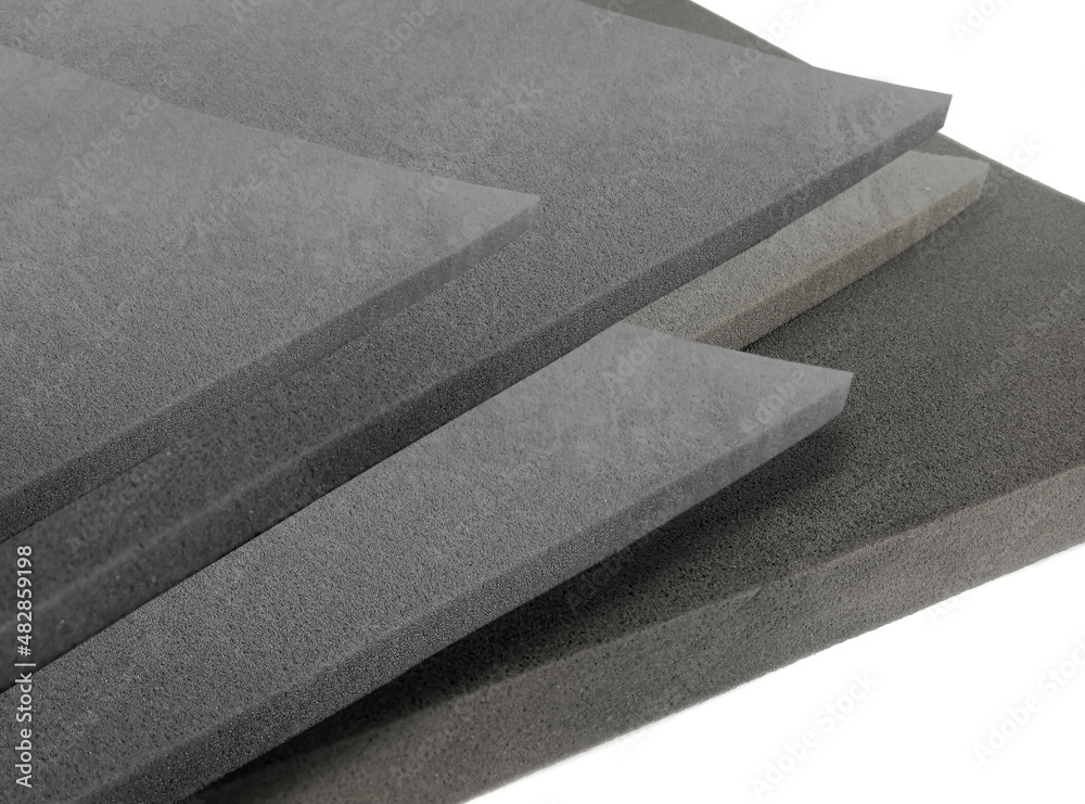 stacked gray spongy foam. square sponge foam sheet and pieces isolated ...