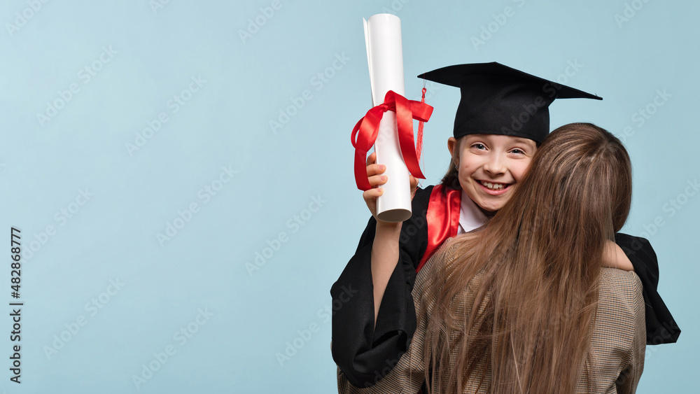 Little girl graduate celebrating graduation. Child wearing graduation ...