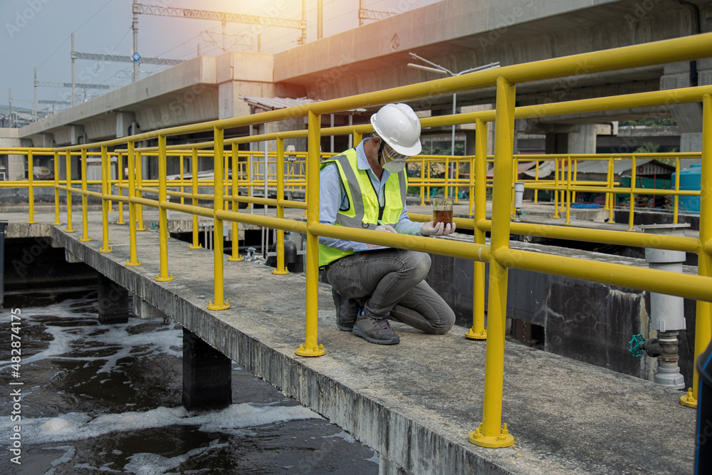workers at work on site. Wastewater treatment concept. Service engineer ...