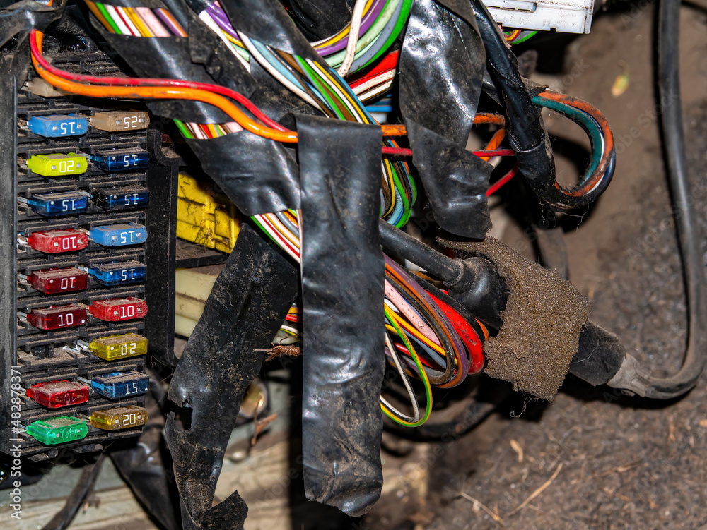 Colored wires and fuse box of the car's internal electrical wiring ...