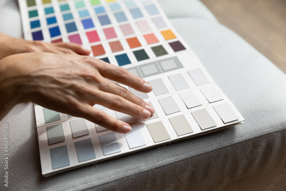 Unrecognizable female hands on paint swatches palette close up. Fashion ...