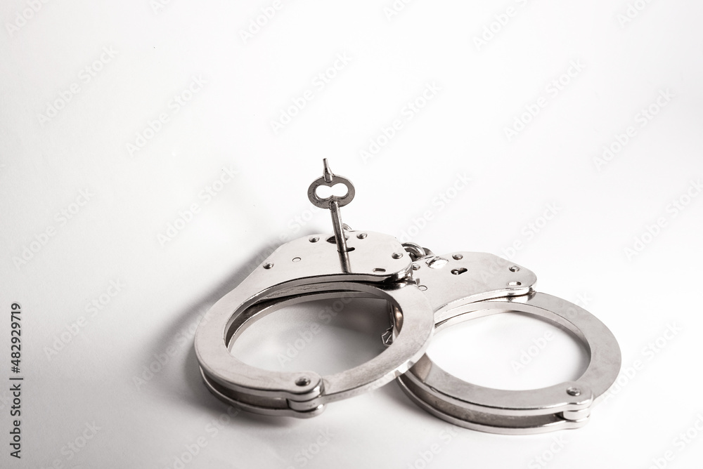 Police handcuffs. Equipment for police officers. Opening handcuffs with ...